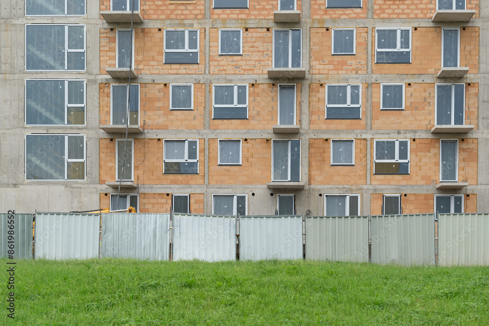 new building the real estate market. New construction building. red ...