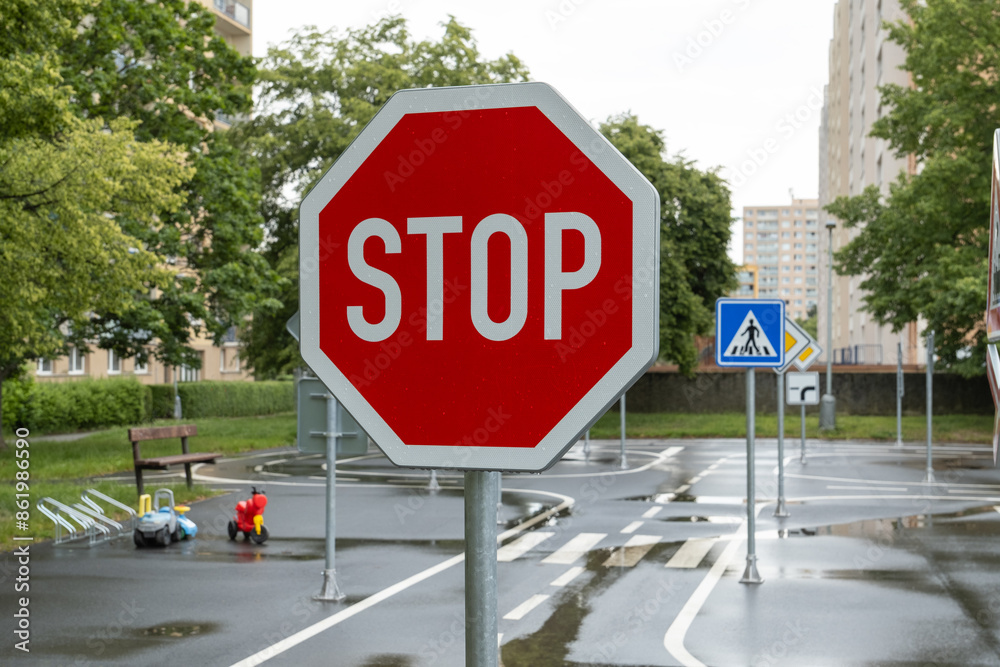 stop road sign on kid's playground designed as a mini road with signs ...