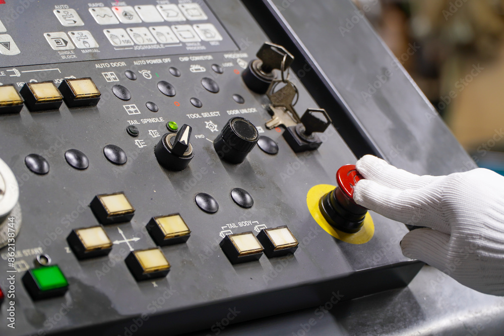 Press the emergency button on cnc machine control panel at factory ...