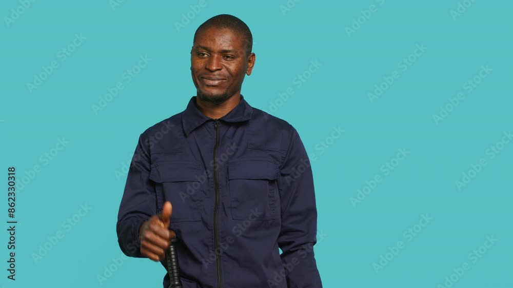 Happy security guard doing thumbs up sign gesturing with finger ...