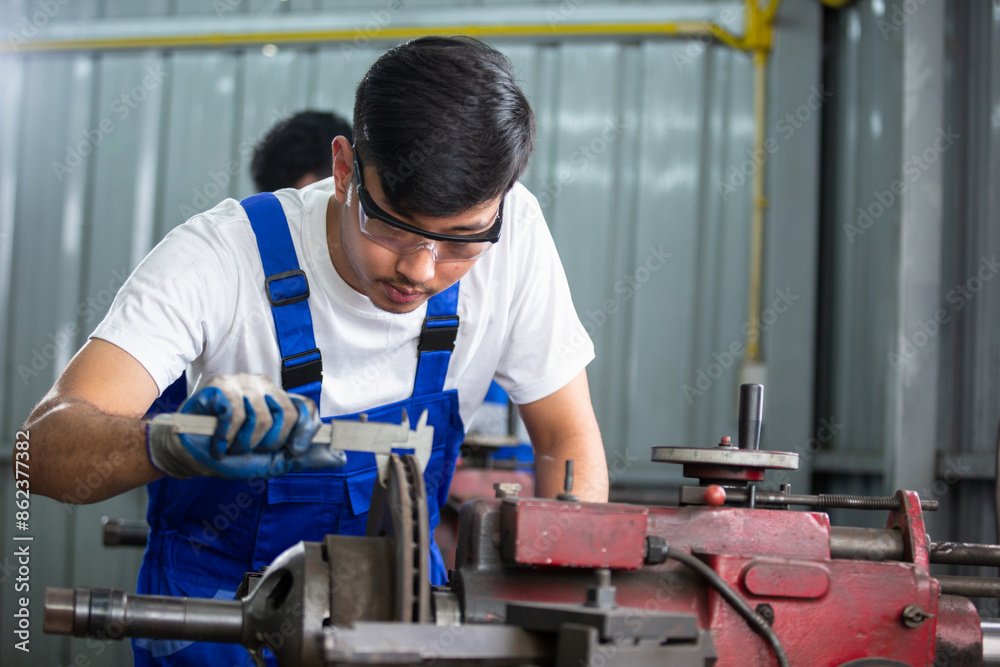 Foto de Engineering worker man wearing uniform safety working using ...