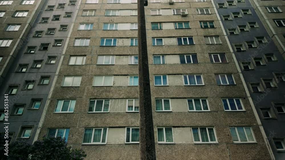Low angle POV footage of a layered concrete prefab Soviet-era high-rise ...