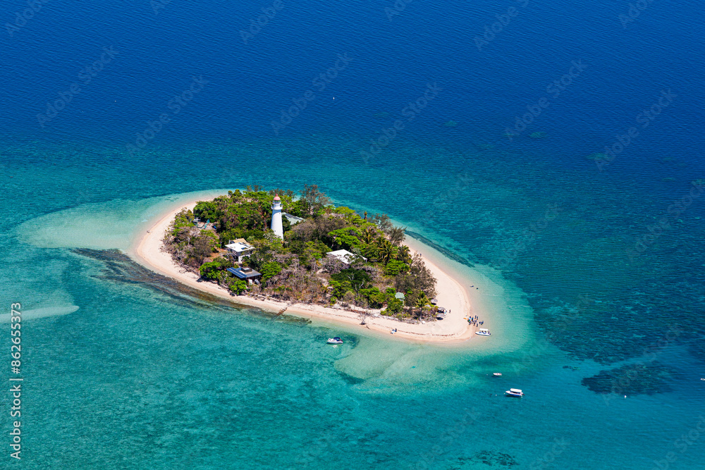 Aerial view of isolated island with turquoise water and sandy beach ...