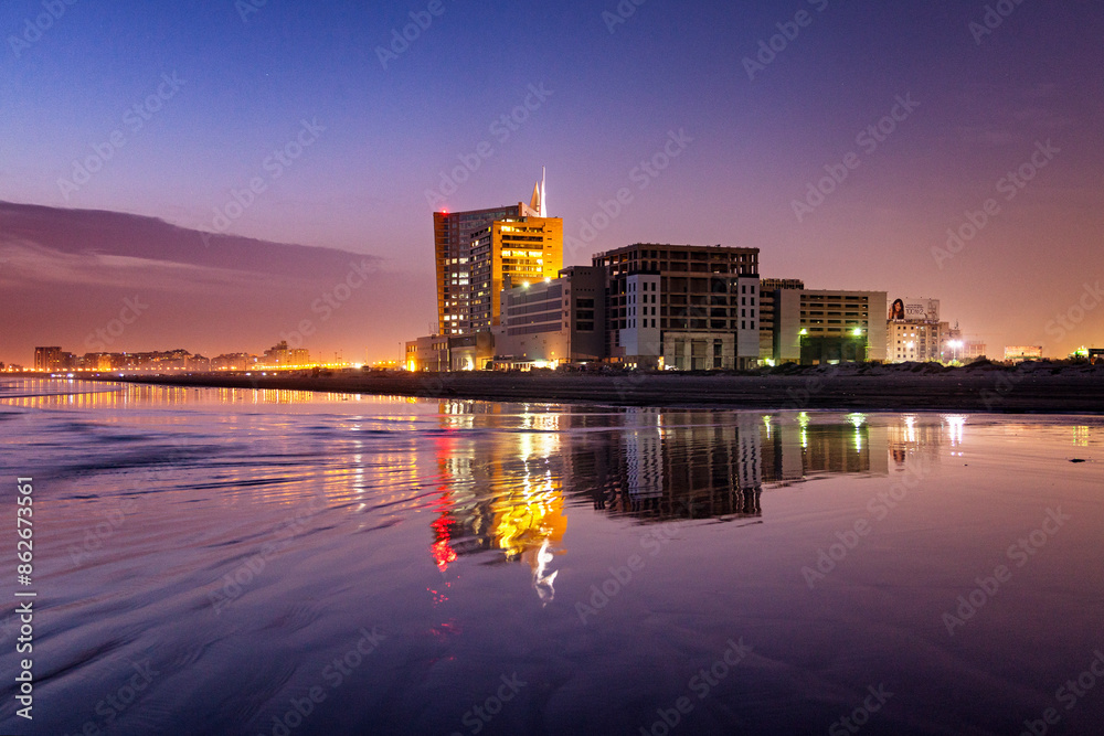 View of Dolmen Mall and city skyline reflection at night, Karachi ...