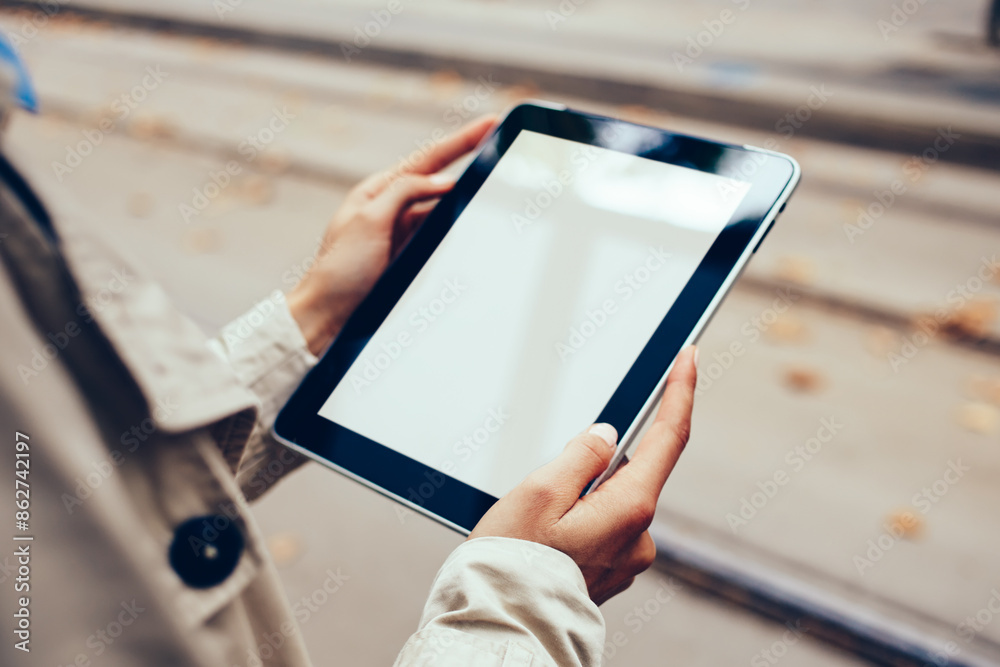 Hipster girl holding modern touch pad device with copy space display ...