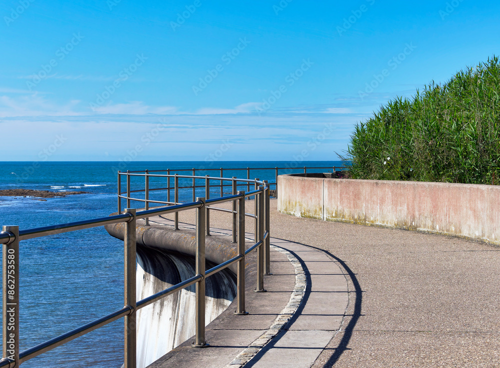 A 390 metre sea defence wall completed in 2014 to shore up and ...