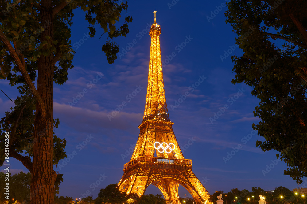 The night view of Eiffel tower with Olympic rings of the Paris 2024 ...
