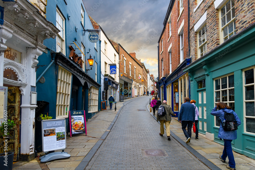 Pedestrians walk the narrow historic Saddler Street, once the only ...