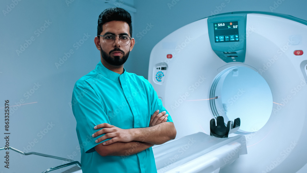 Indian tomography specialist posing with crossed arms. Confident doctor ...