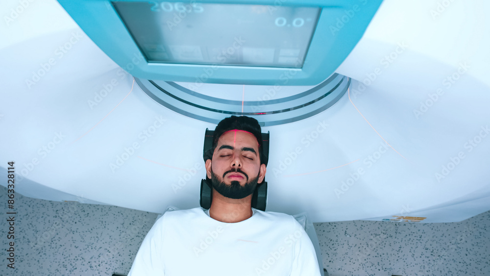 Patient finishing magnetic resonance imaging procedure. Positron ...