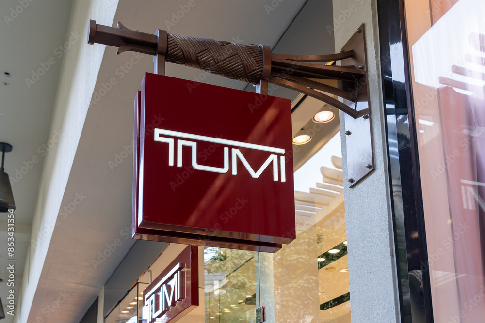 Honolulu, HI, USA - January 14, 2024: Tumi logo sign at their store in a shopping mall in ...