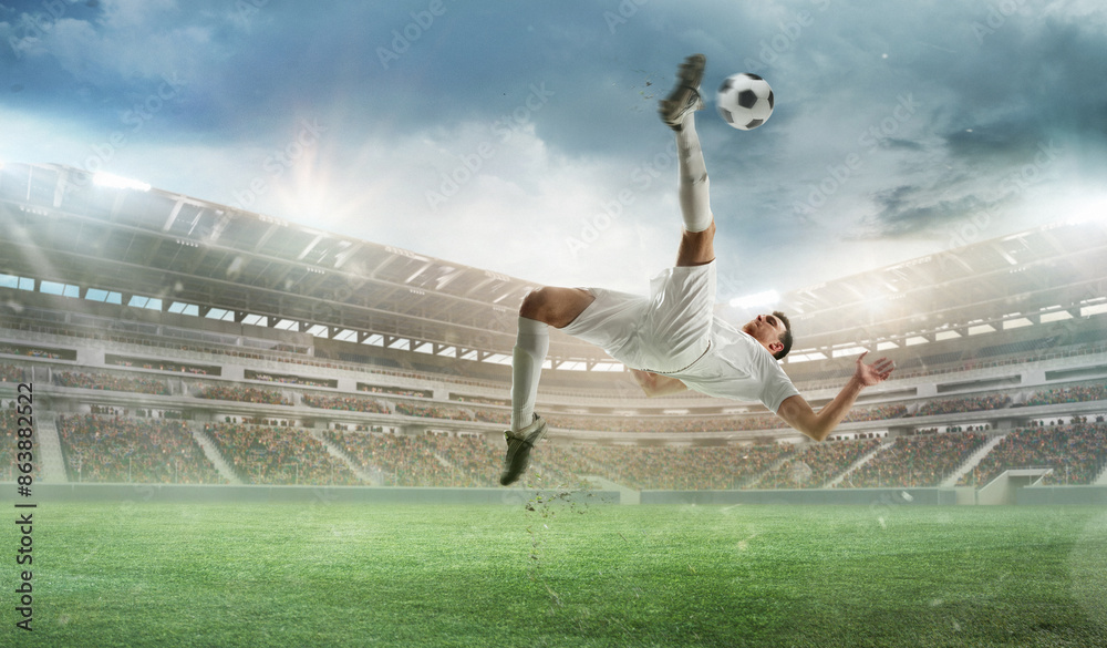 Dynamic image of competitive man in white uniform, soccer player during ...