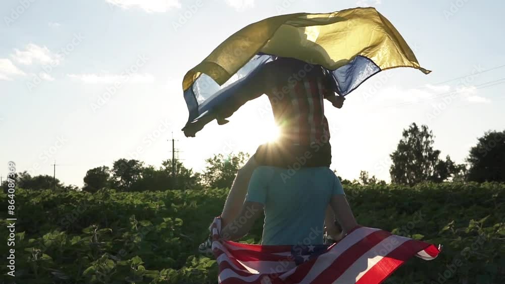 Father and son hold American and Ukrainian flags. Symbol of US support ...