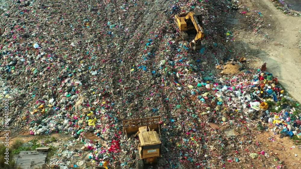 A massive landfill site with unsorted wastes, highlighting critical ...