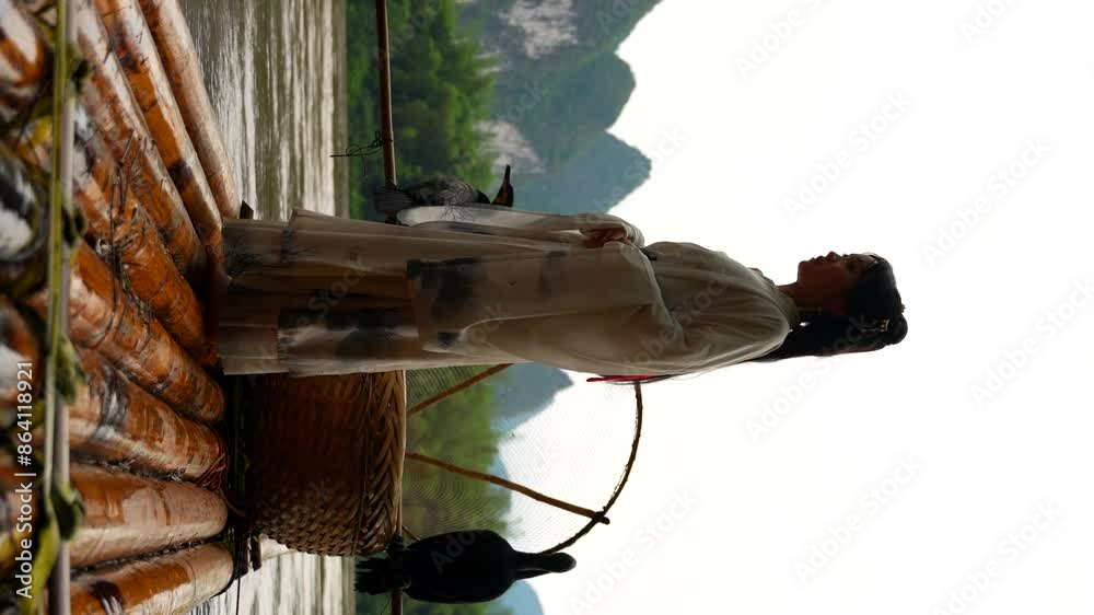 Hanfu girl in traditional clothing on Bamboo raft shakes draping ...
