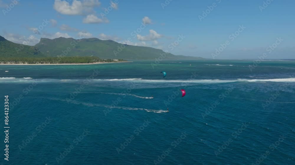 Kitesurfers riding at the famous surf spot One Eye in Mauritius Stock ...