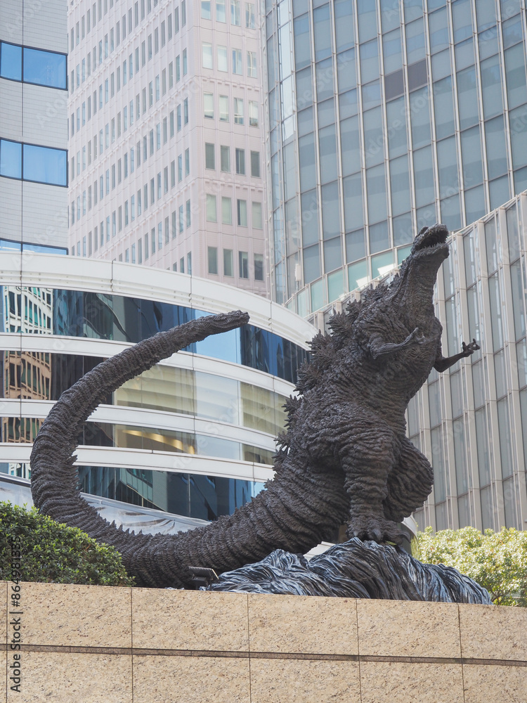 TOKYO, JAPAN - March 31, 2024: A statue of Godzilla in Godzilla Square ...