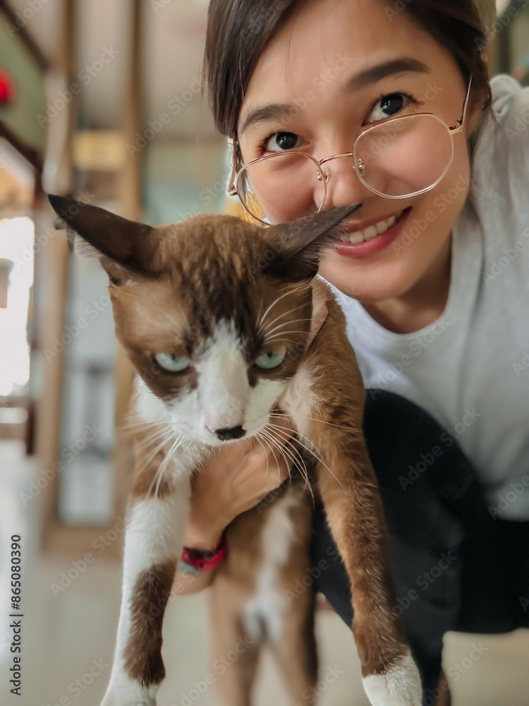 Vertical and close up photo of happy Thai asian woman holding and ...