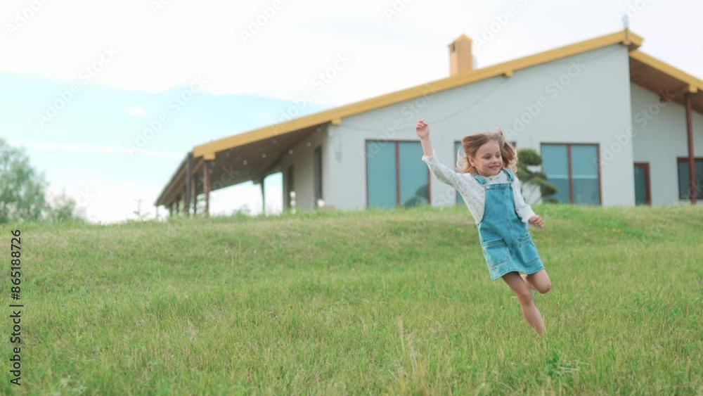 Two Caucasian children playing together in backyard on green grass ...