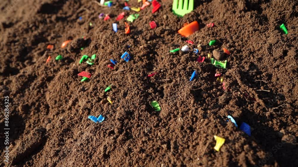 Microplastic pollution. Microplastics in ground. Soil contaminated with ...