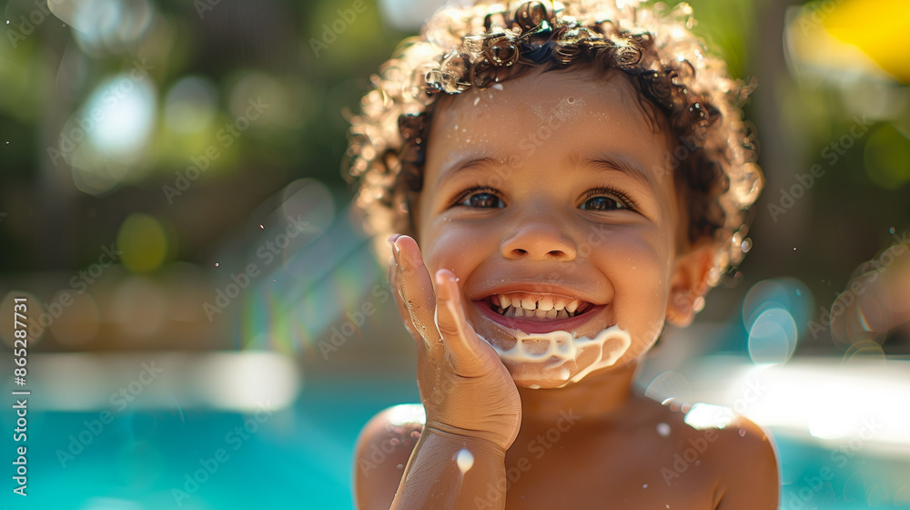Happy child rubbing sun cream on face. Smiling mixed race black boy ...