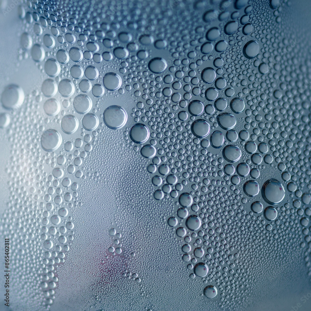 Many silver bubbles in water close up on a blue background. Background ...