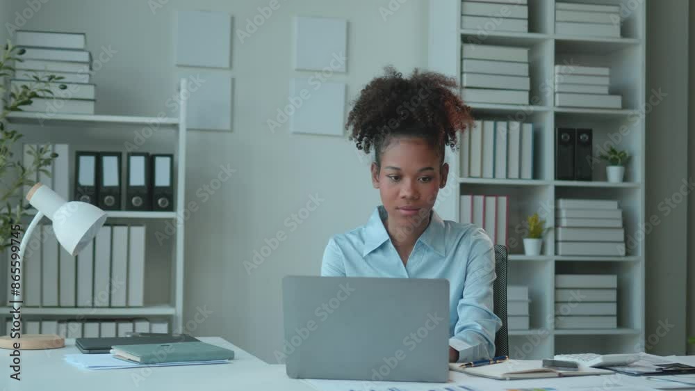 Businesswoman reacts to bad news on her laptop in a modern office ...