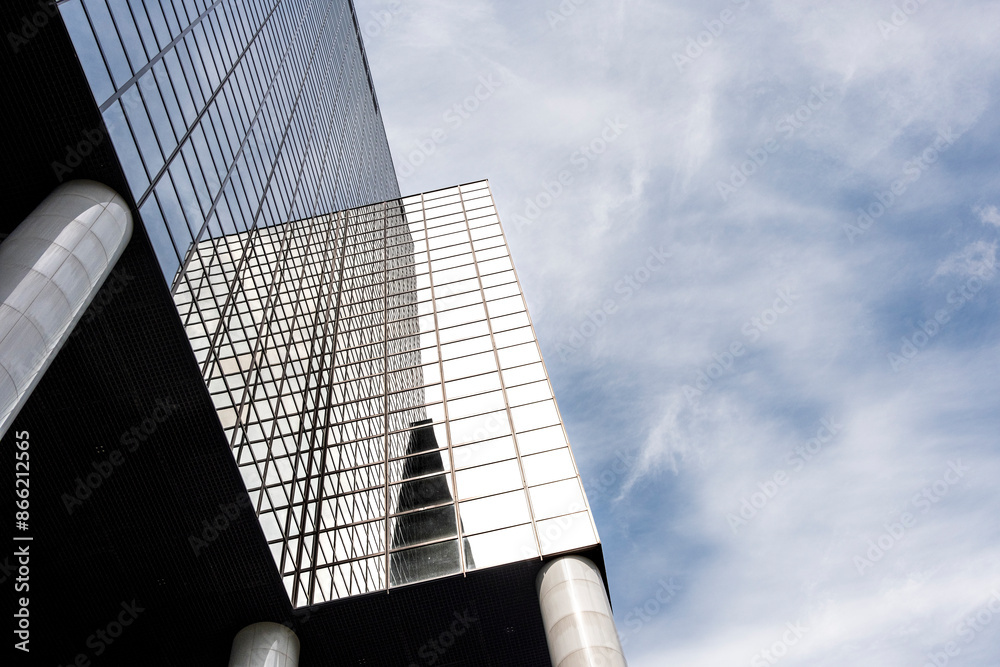 Modern architecture showcasing a reflective glass building facade under ...