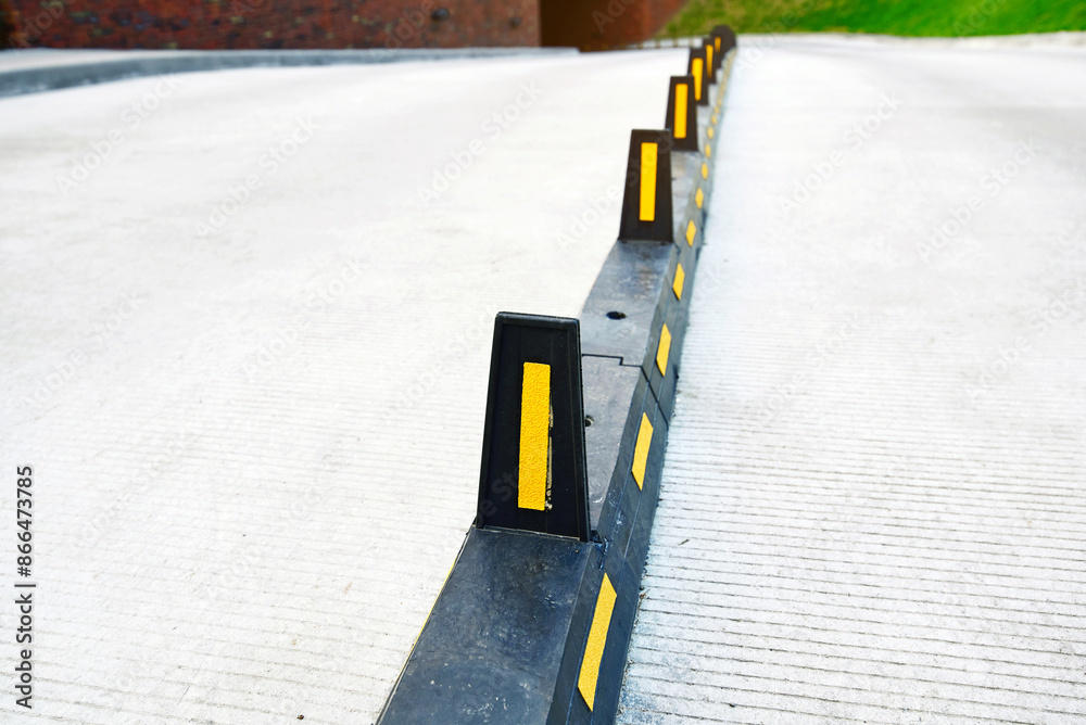 Rubber lane dividers, traffic lane separator closeup. Entrance to ...