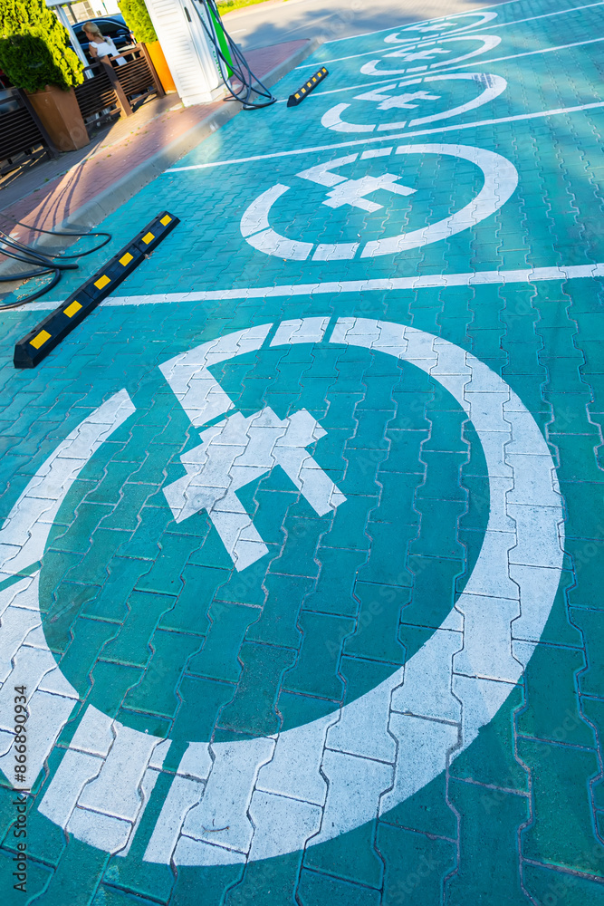 Parking lots for electric cars only. Charging stations stand in a row ...