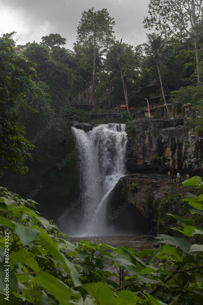 Cascading multi-level waterfall named Tegenungan Waterfall in the ...