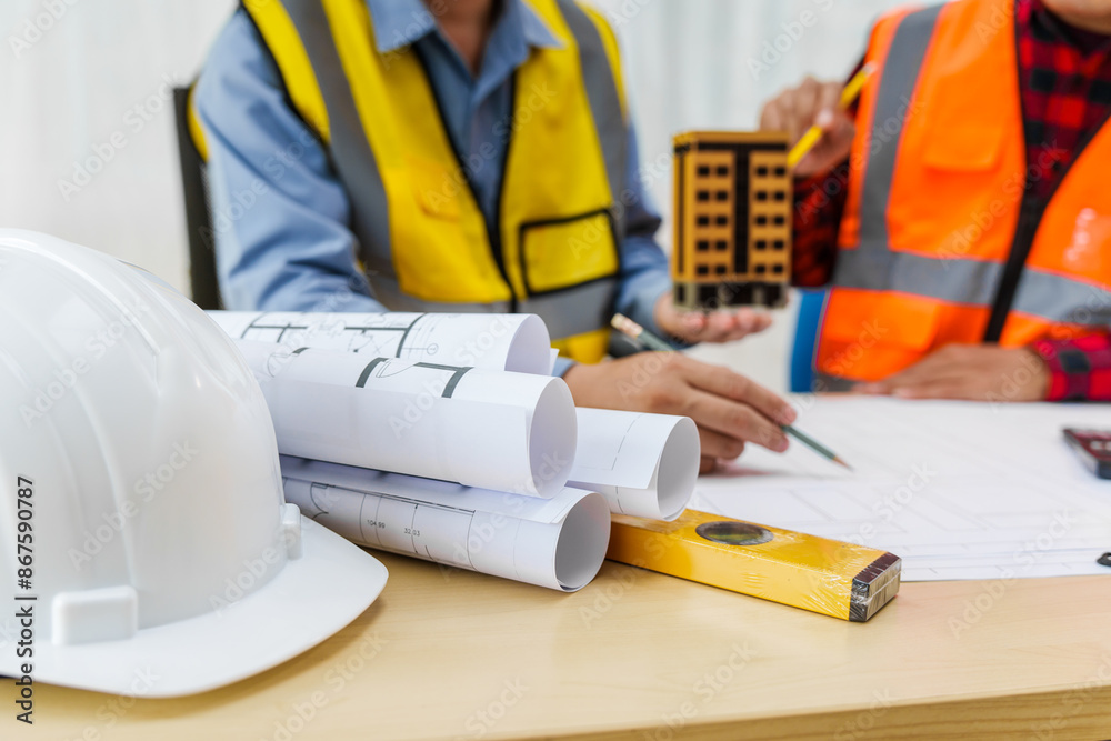 Two men, including a male Asian construction contractor engineer ...