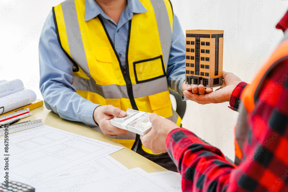 Two men, including a male Asian construction contractor engineer ...