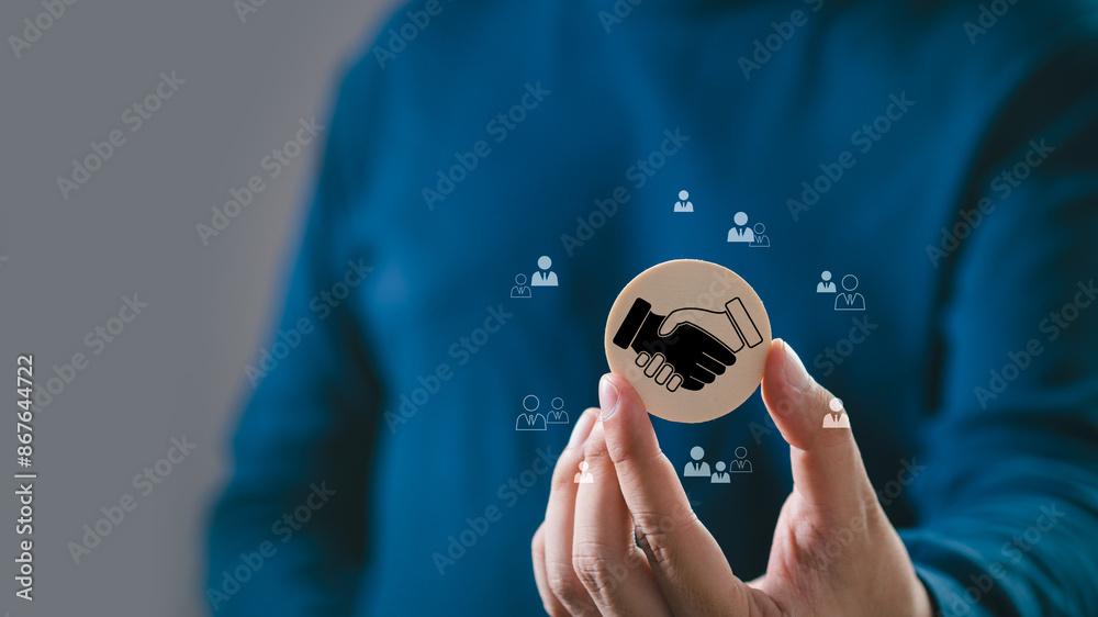 Hand holding handshake icon, symbolizing business partnership ...