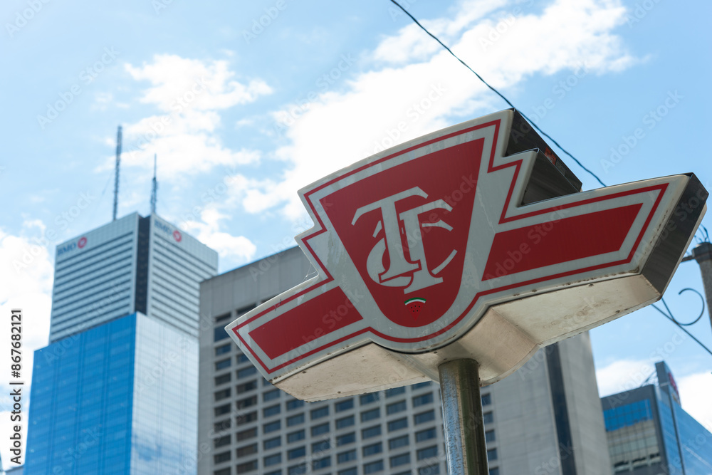 public transit logo sign located outside a subway station in downtown ...
