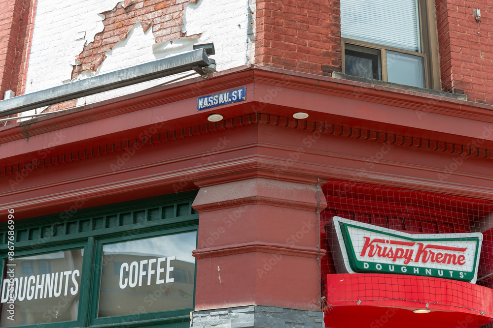 close-up exterior building and sign of Krispy Kreme Café, a donut shop ...