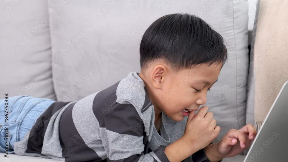 Asian little boy addicted to modern technology laptop connected to ...