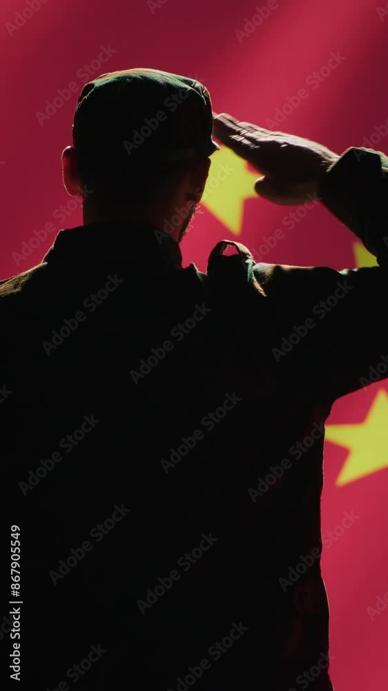 Vertical video Member of chinese army doing saluting hand gesture ...