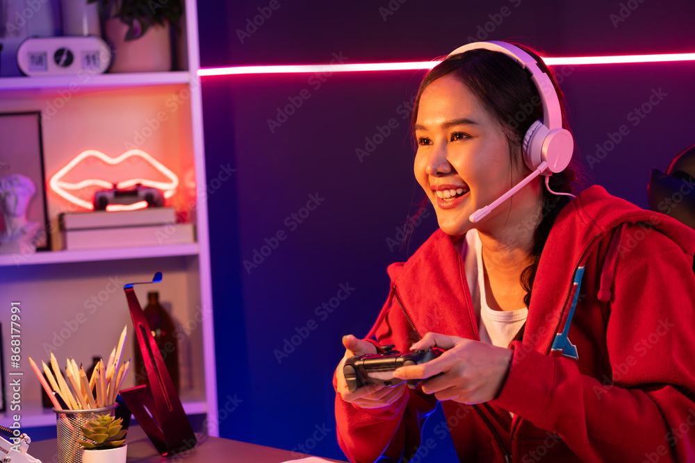 Host channel of smiling beautiful Asian girl streamer with joystick ...