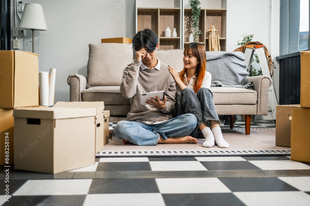 A stressed young couple faces financial challenges, struggling with ...