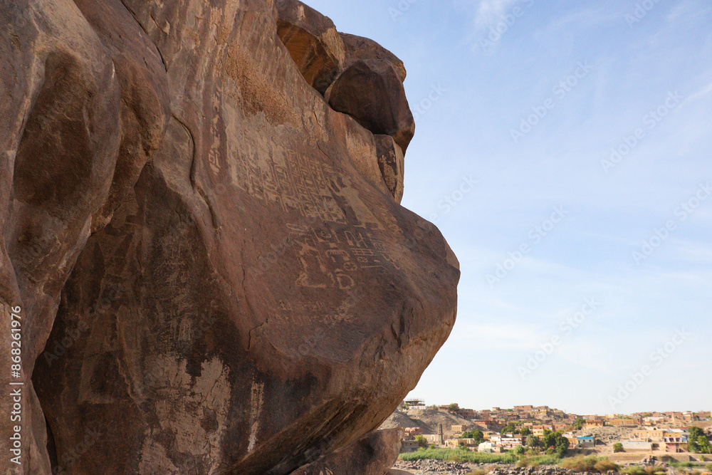 Ancient egyptian carvings and hieroglyphs on granite rocks near Famine ...