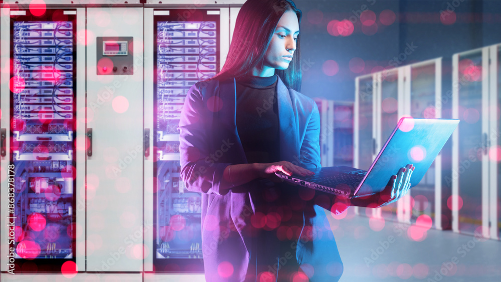Woman in server room. Data center manager. System administrator with ...