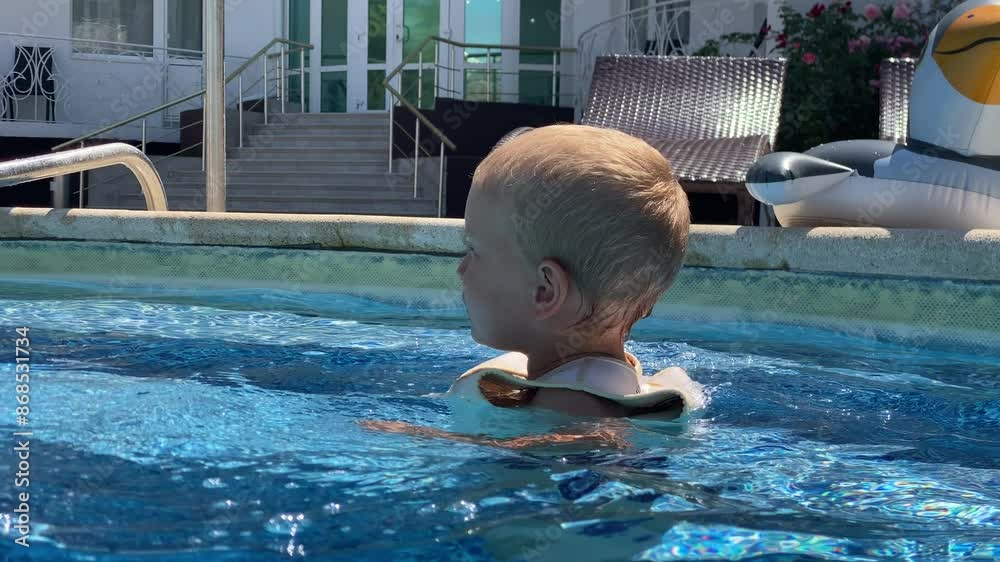 Happy little boy in swim vest life jacket for kids learning to swim in ...