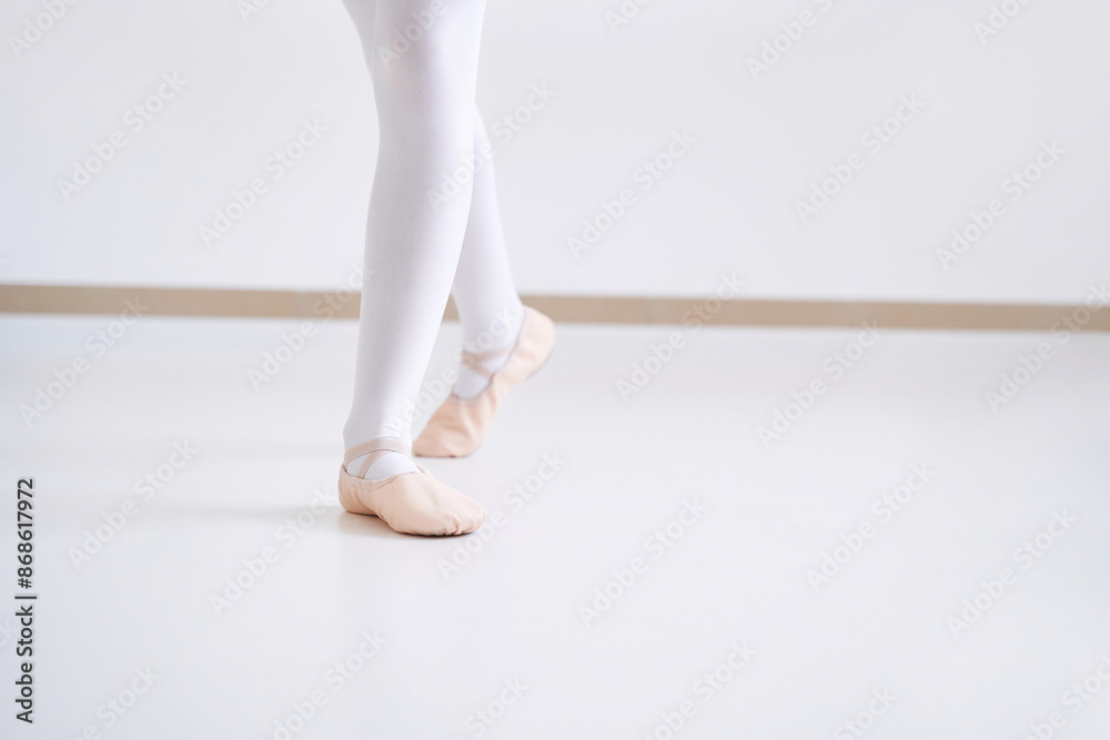 Young ballet girl at studio lesson. Training performance. Stretching ...