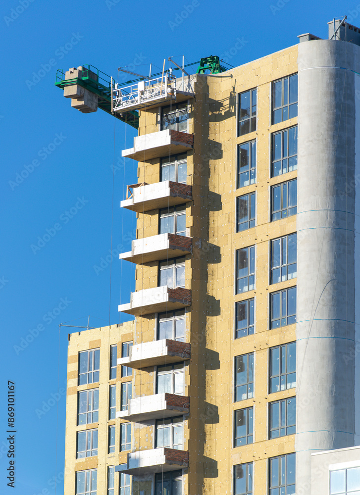 Installation of external wall thermal insulation with rock wool ...