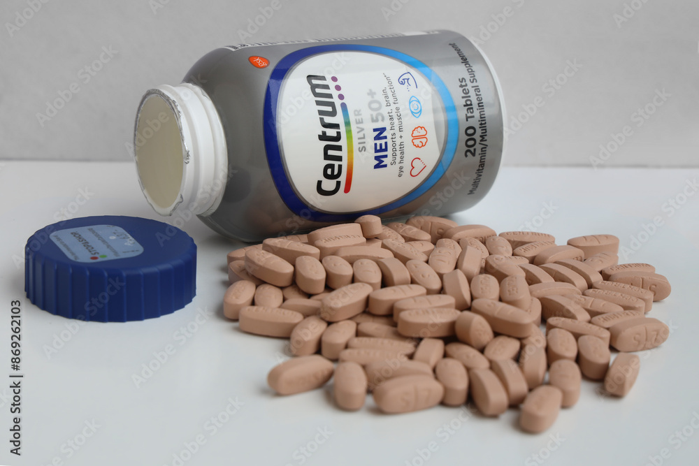 BATUMI, GEORGIA - JUNE 26, 2024: Centrum bottle with pink pills ...