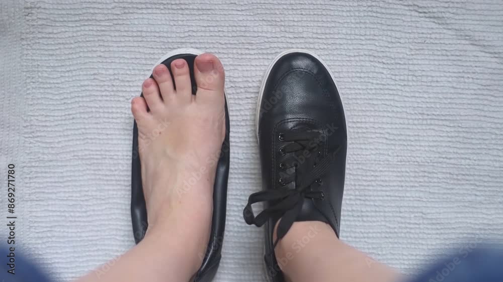 Foot deforming shoes. Incorrect anatomical shoes with flat soles. Small ...