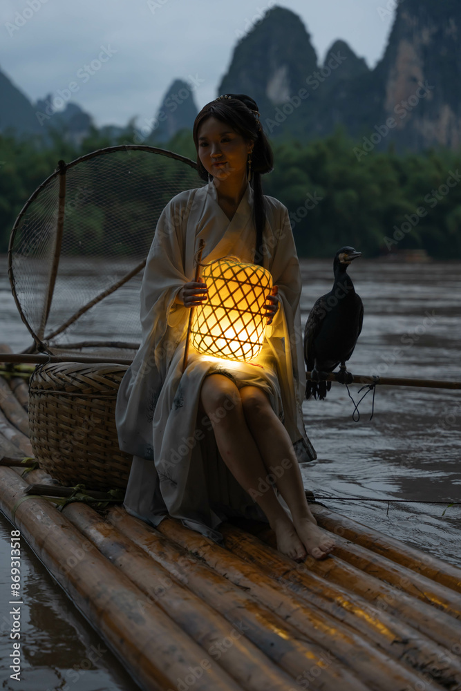 Scene of Hanfu girl on Bamboo raft positing with arms opened at blue ...
