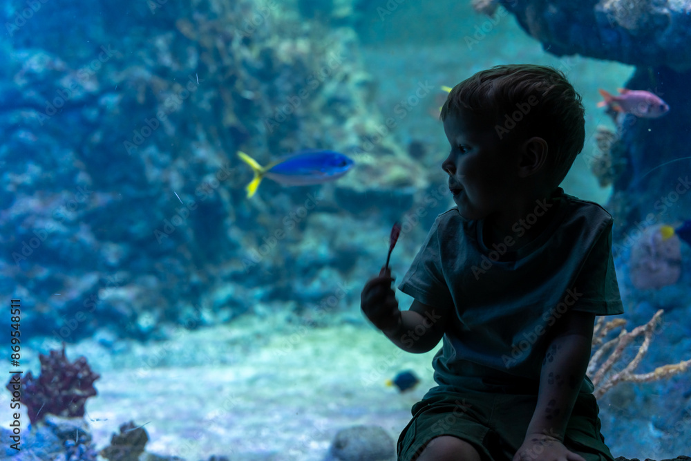 Family in aquarium. Kids watch tropical fish, marine life. Child ...