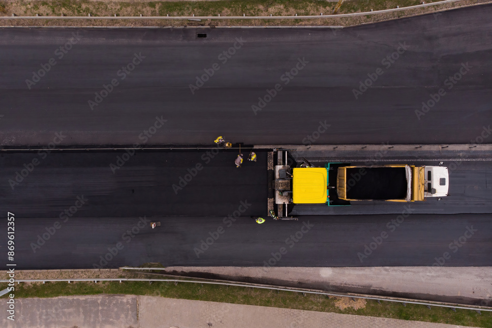 Aerial photograph shows truck loaded with asphalt mixture for laying ...